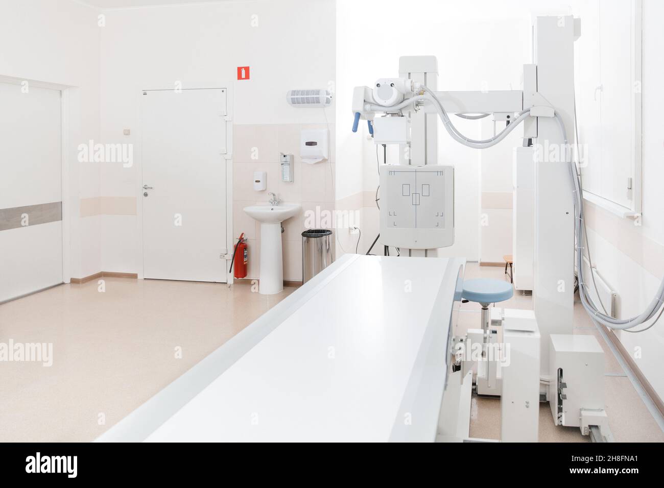 X-ray department in modern hospital. Radiology room with scan machine ...