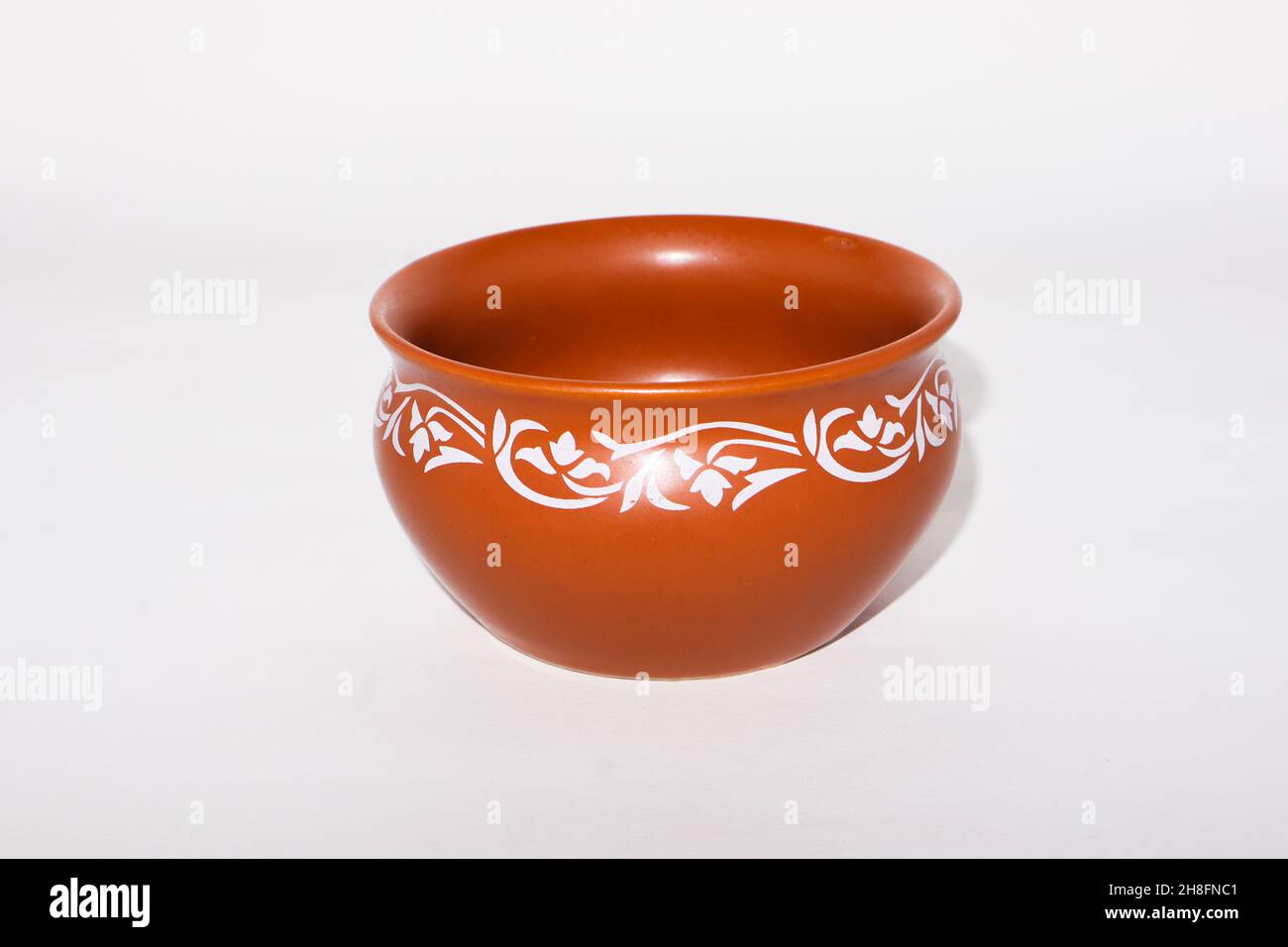 Empty clay pot on white background Stock Photo - Alamy