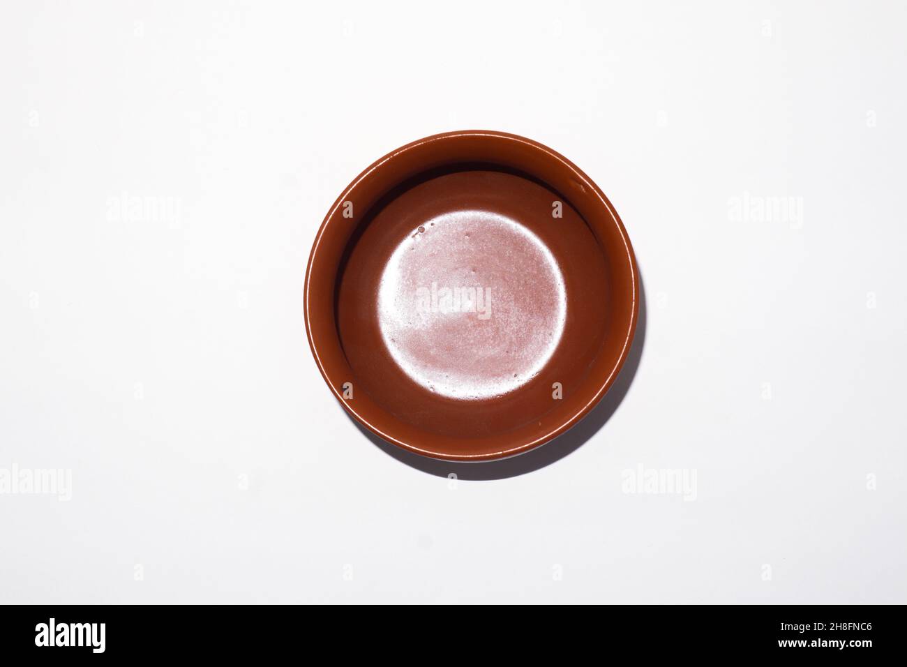 Empty clay pot on white background Stock Photo - Alamy