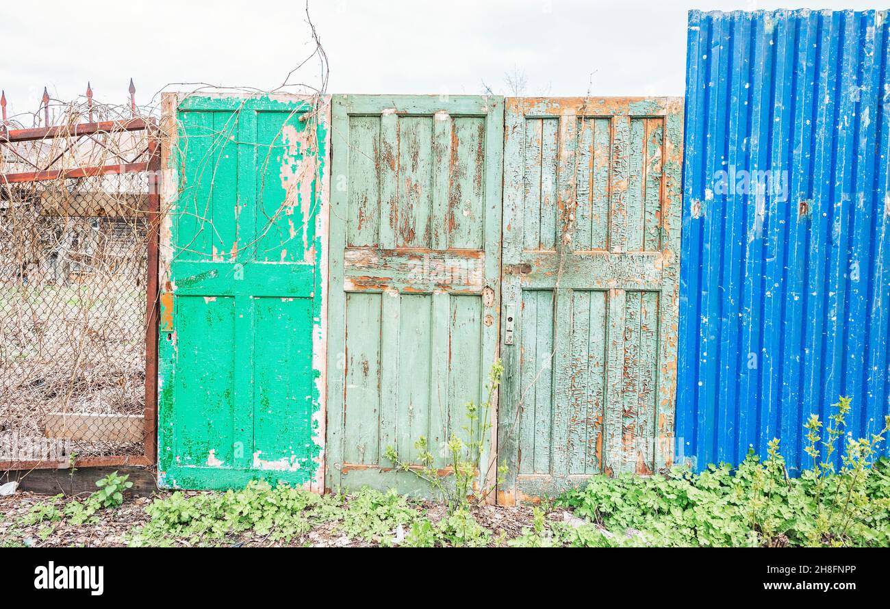 Fence in the Russian countryside from different kinds of materials ...