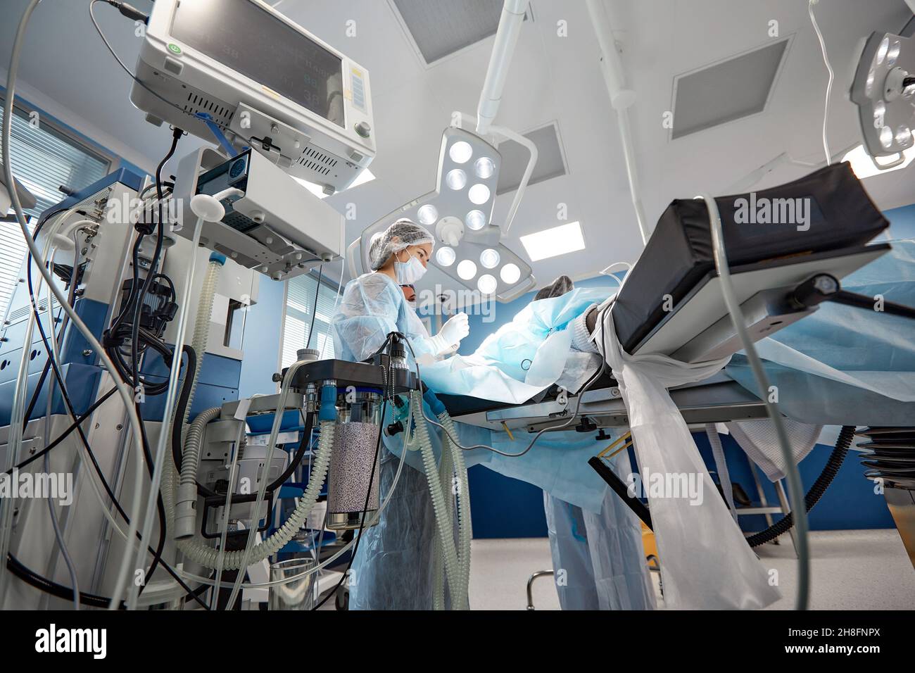 surgeon keeping track of vital functions of the body during cardiac ...