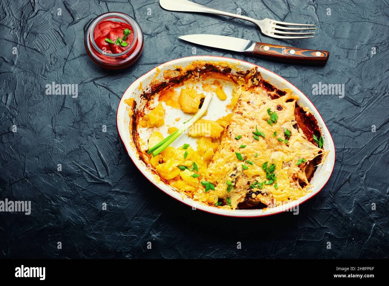 Veal, potato and cheese casserole. Meat gratin with potatoes and cheese ...