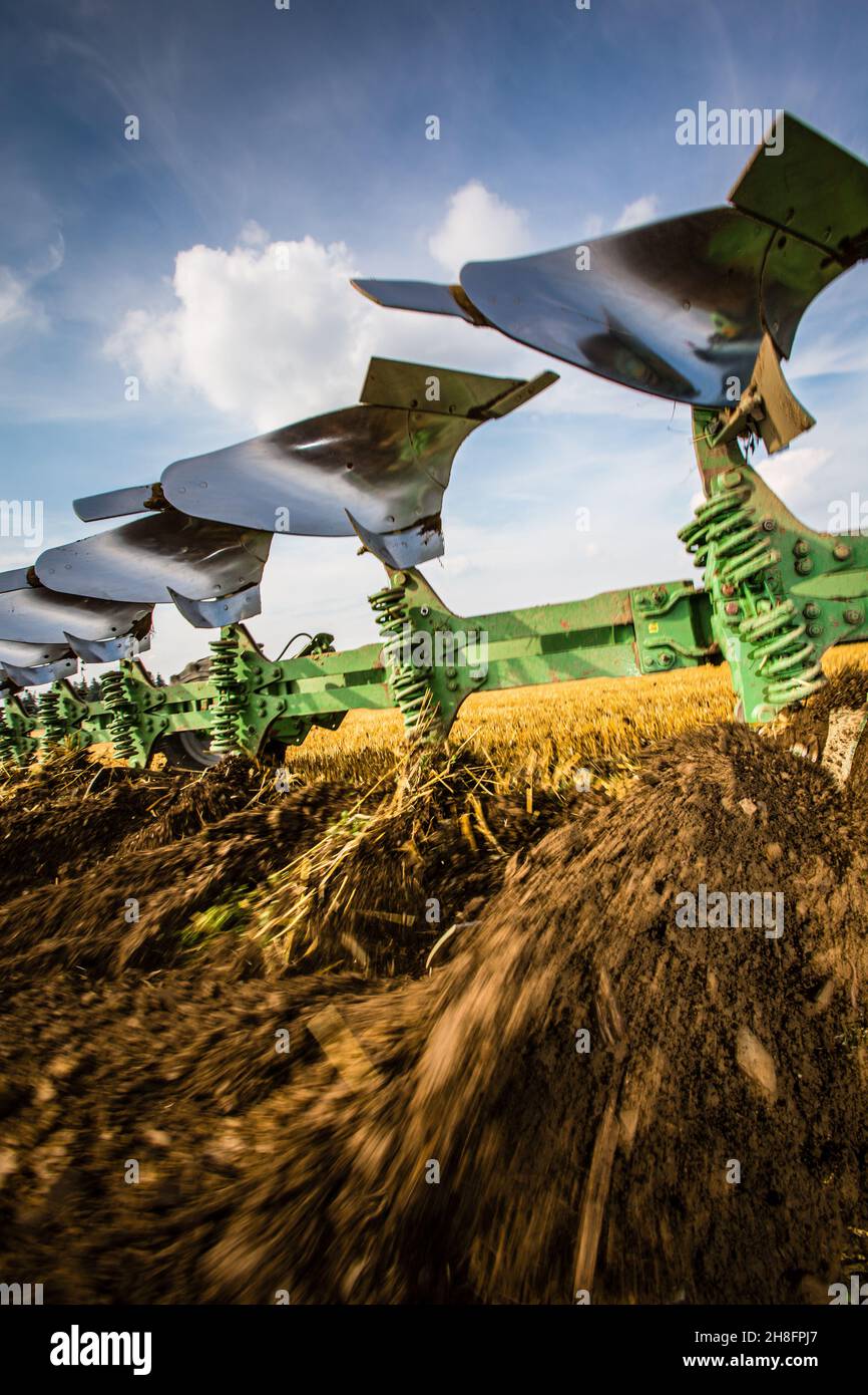 Tractors working on a farm field, - agricultural machines at work Stock ...