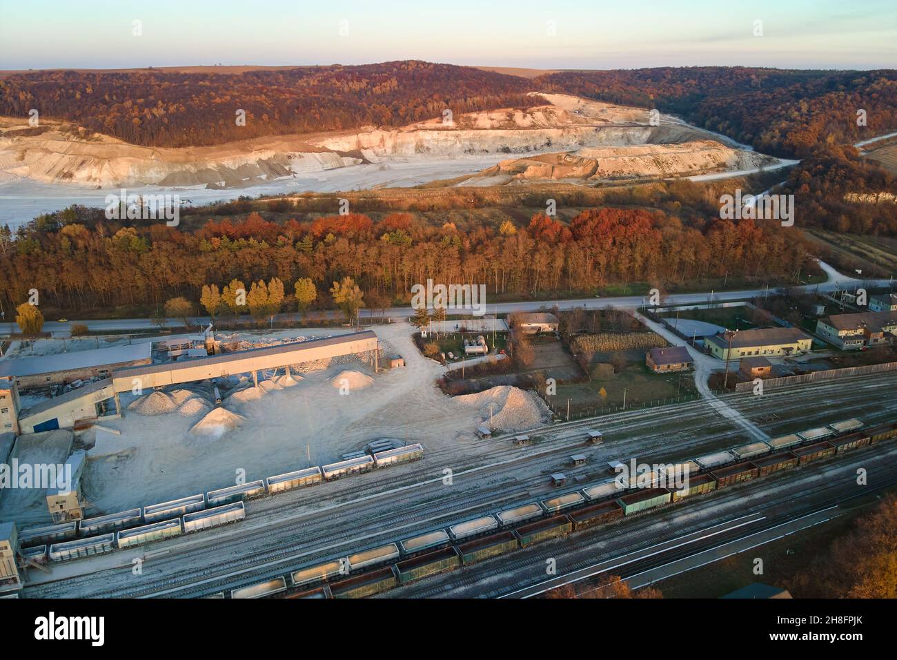 Aerial view of cargo train loaded with crushed stone materials at ...