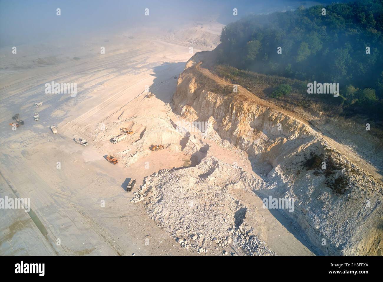 Aerial view of open pit mining of limestone materials for construction ...