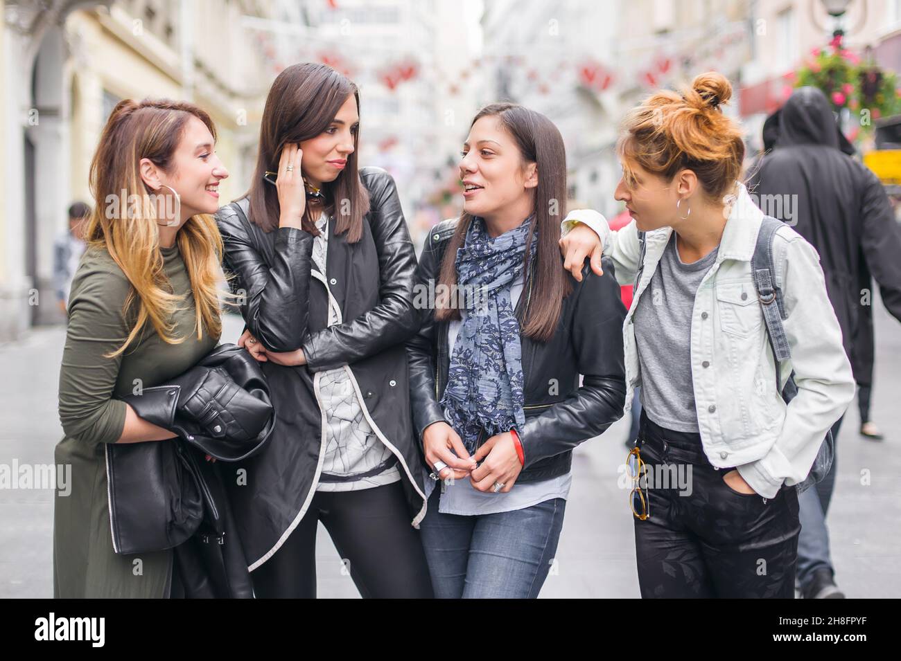 Happy girls friends talking online hi-res stock photography and images ...