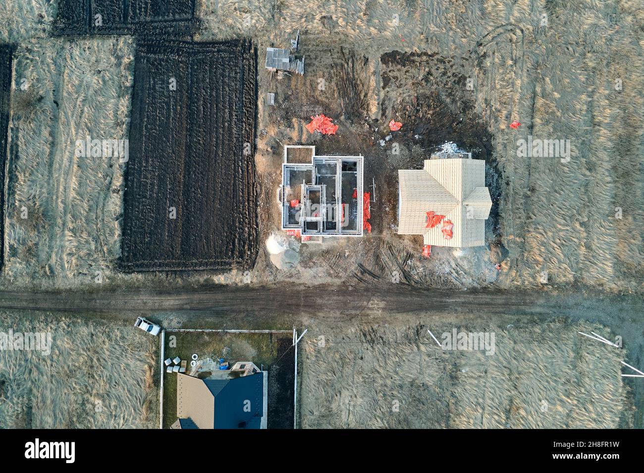 Aerial view of unfinished frame of private house foundation under ...