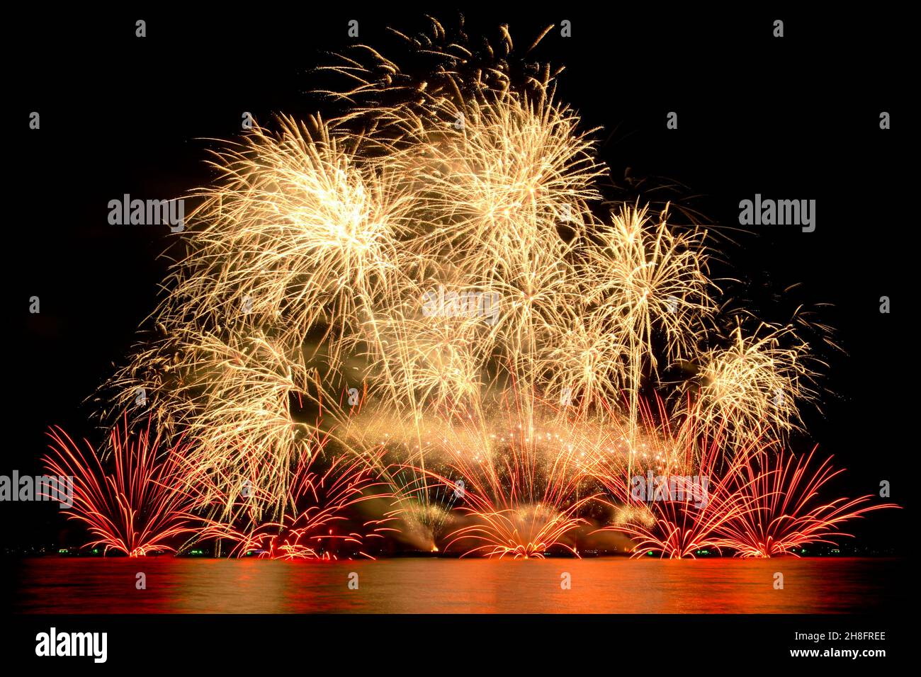 Firework celebration from the sea shore. Colorful fireworks celebration ...