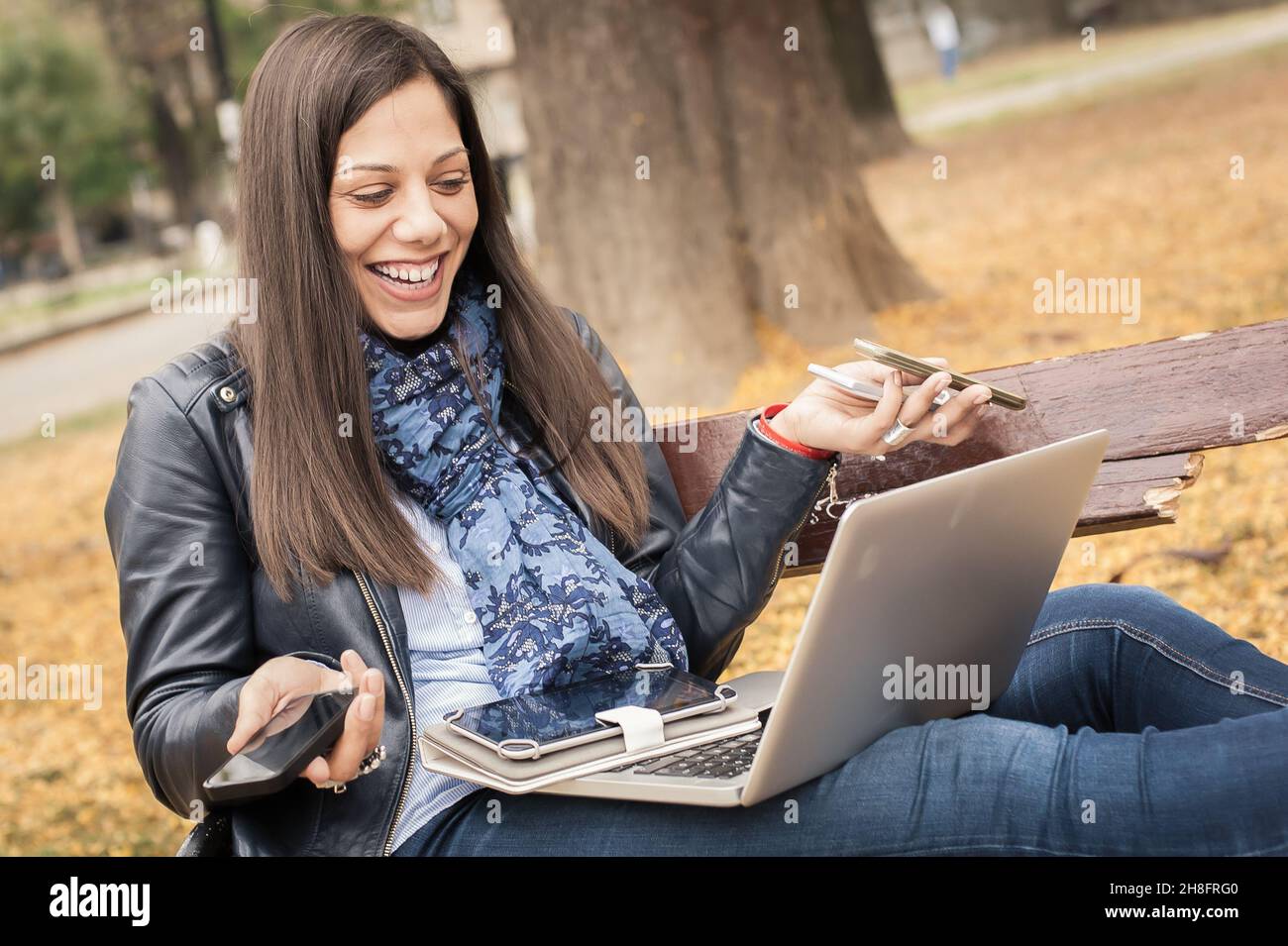 Hysterical young girl with too many screens, mobile phones, tablets and ...