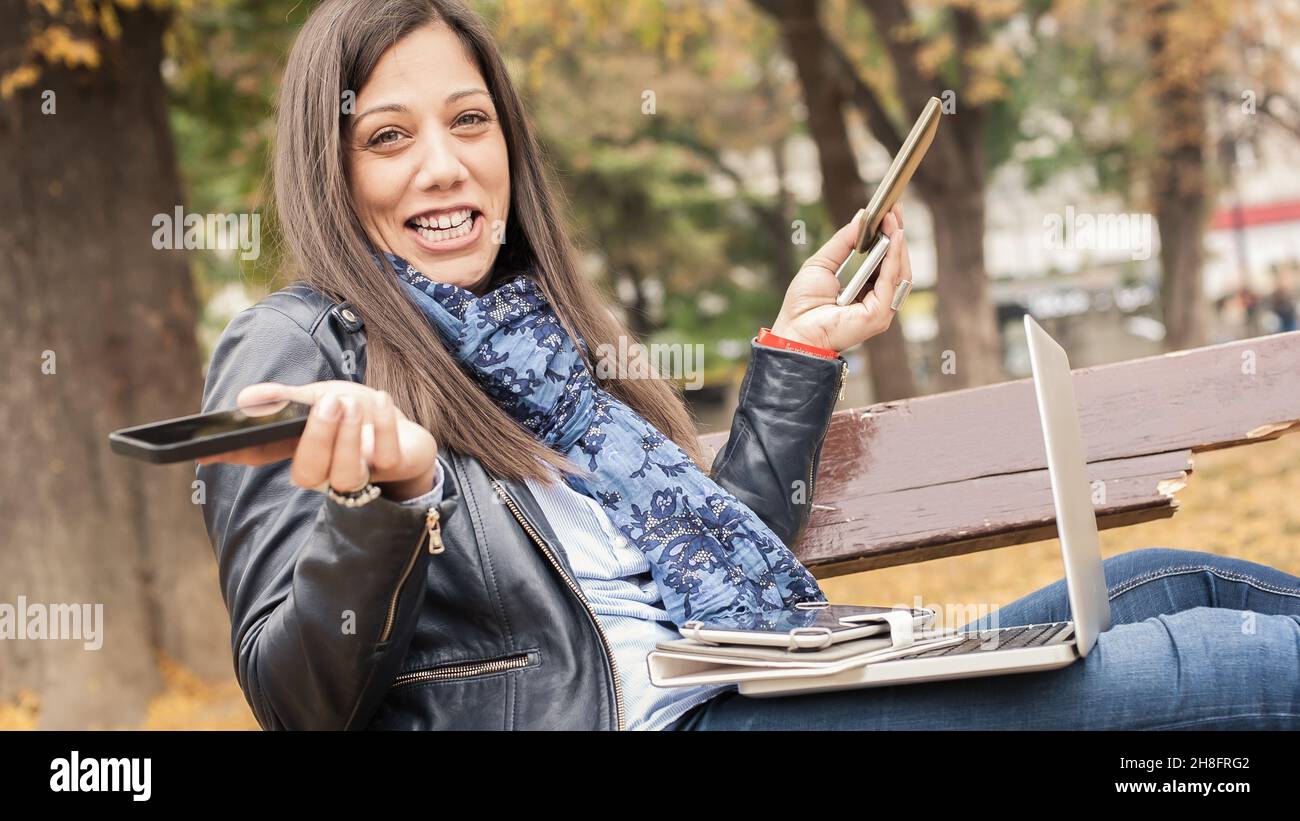Hysterical young girl with too many screens, mobile phones, tablets and ...