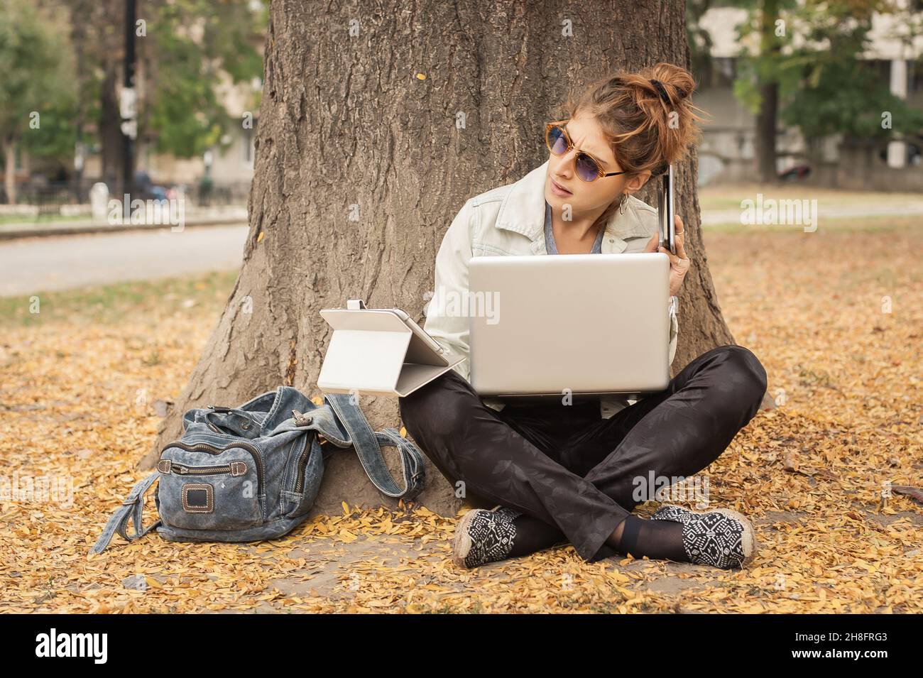 Hysterical young girl with too many screens, mobile phones, tablets and ...