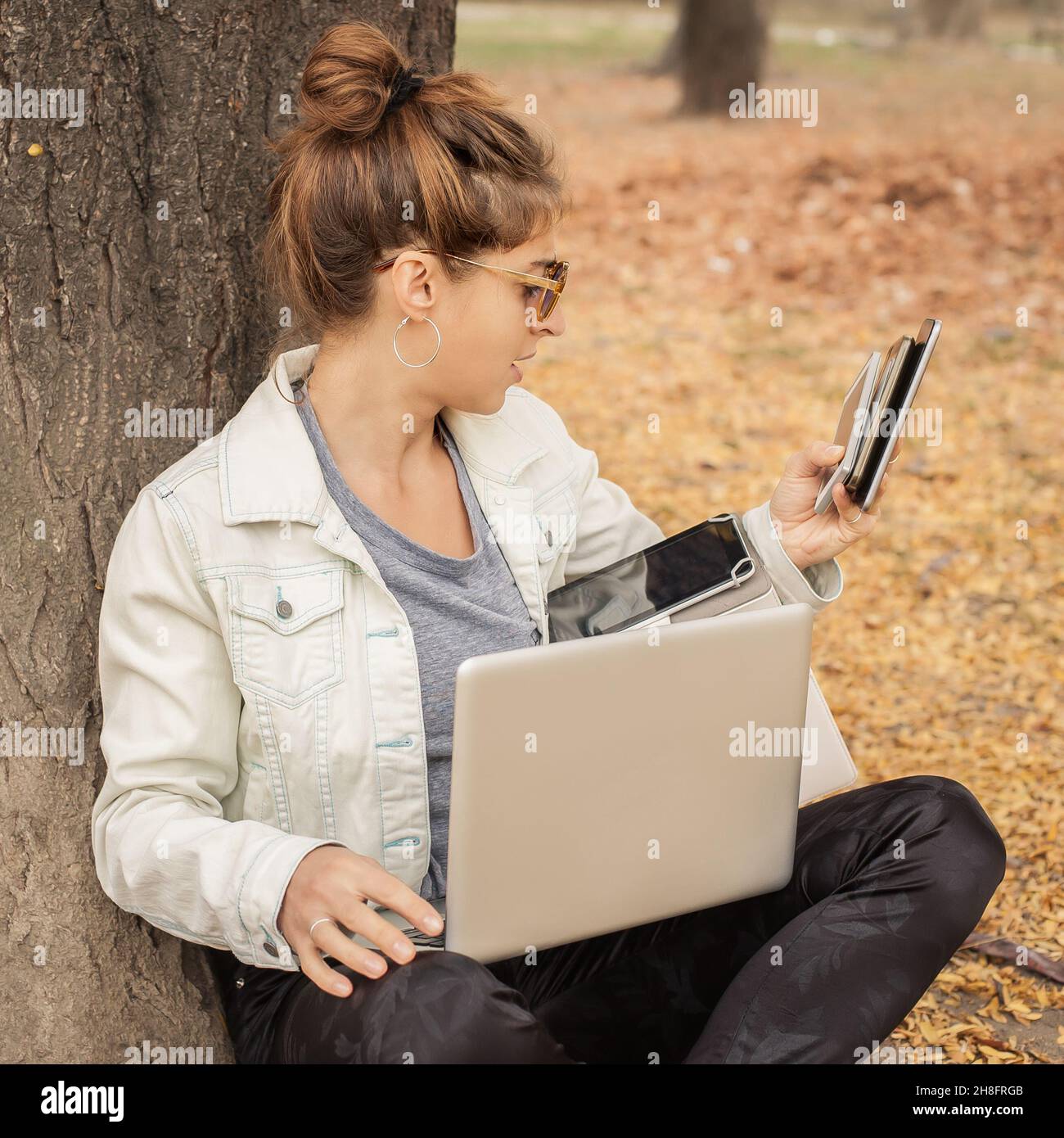 Hysterical young girl with too many screens, mobile phones, tablets and ...