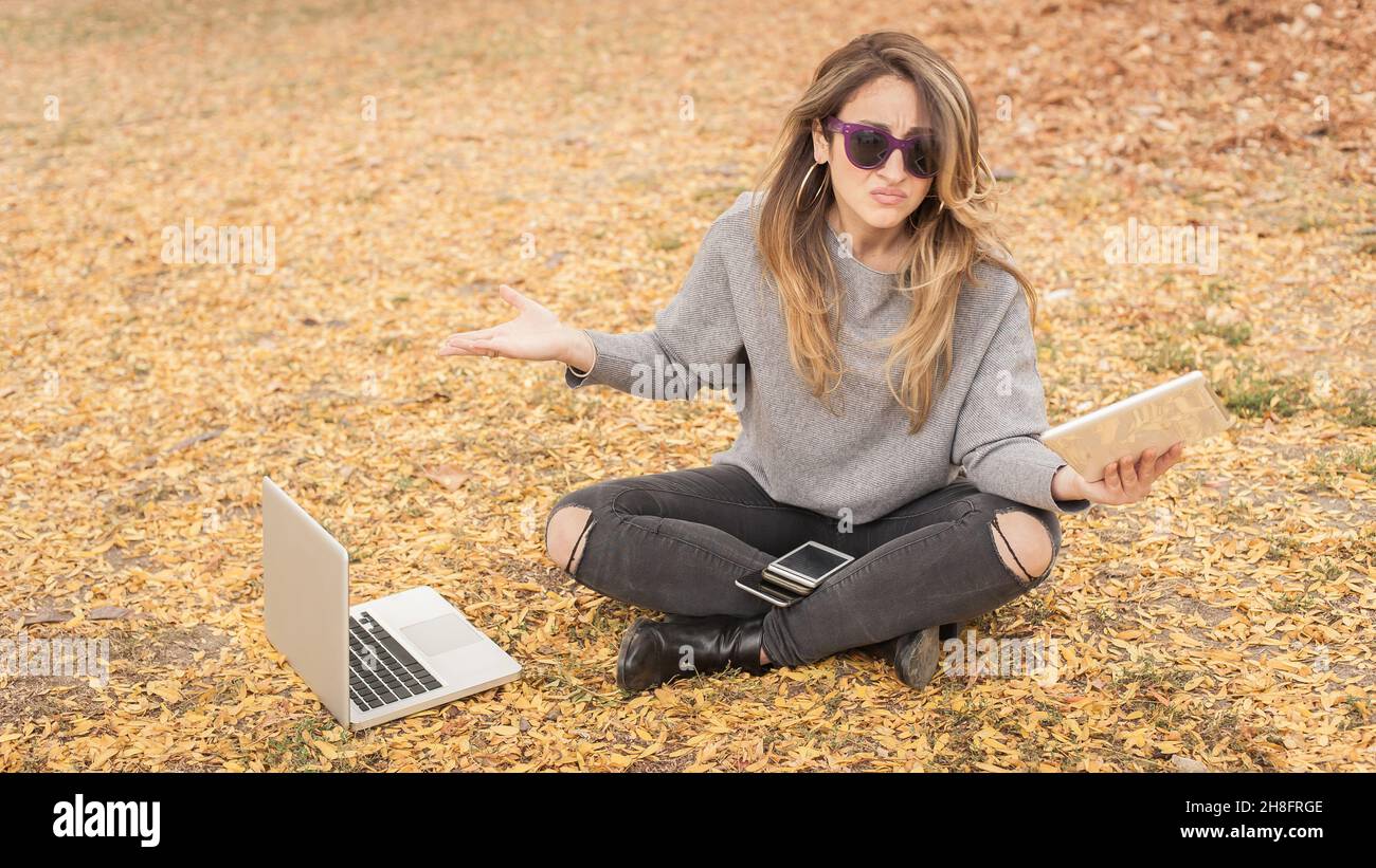 Hysterical young girl with too many screens, mobile phones, tablets and ...