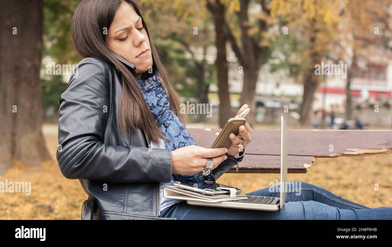 Hysterical young girl with too many screens, mobile phones, tablets and ...