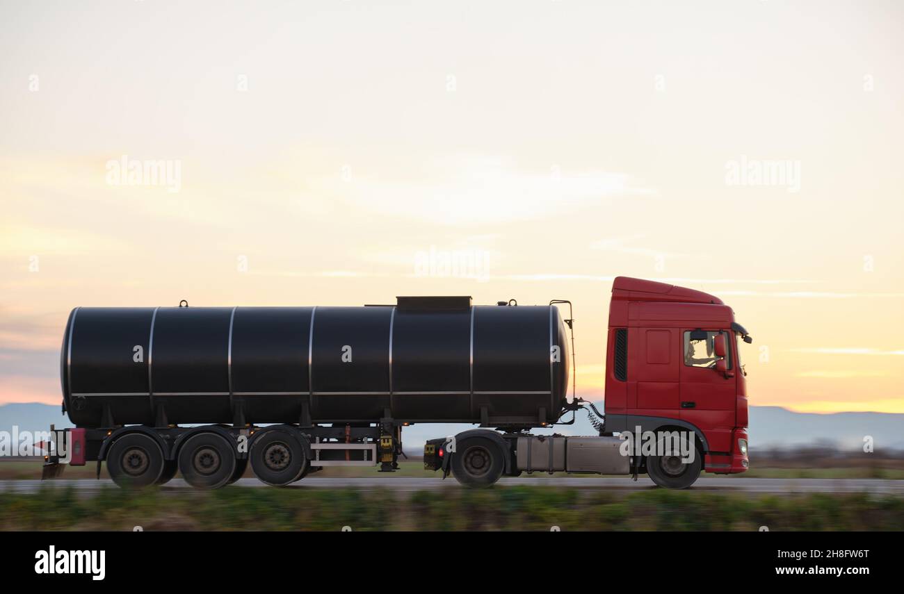 Petrol cargo truck driving on highway hauling oil products. Delivery ...