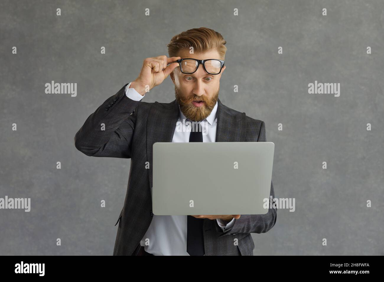 Surprised man looking computer screen hi-res stock photography and ...