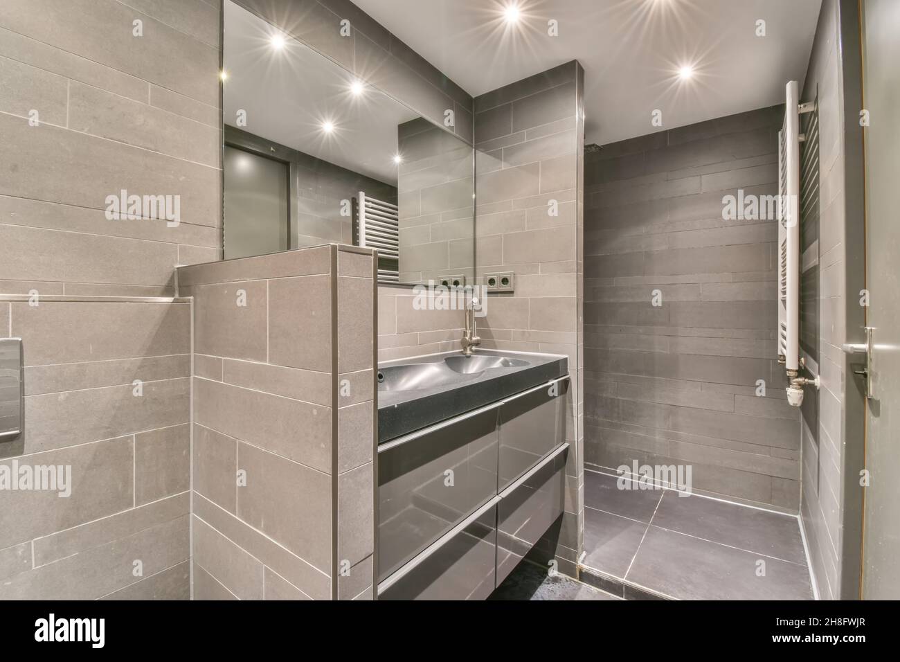 Luxury interior design of a bathroom with marble walls Stock Photo - Alamy