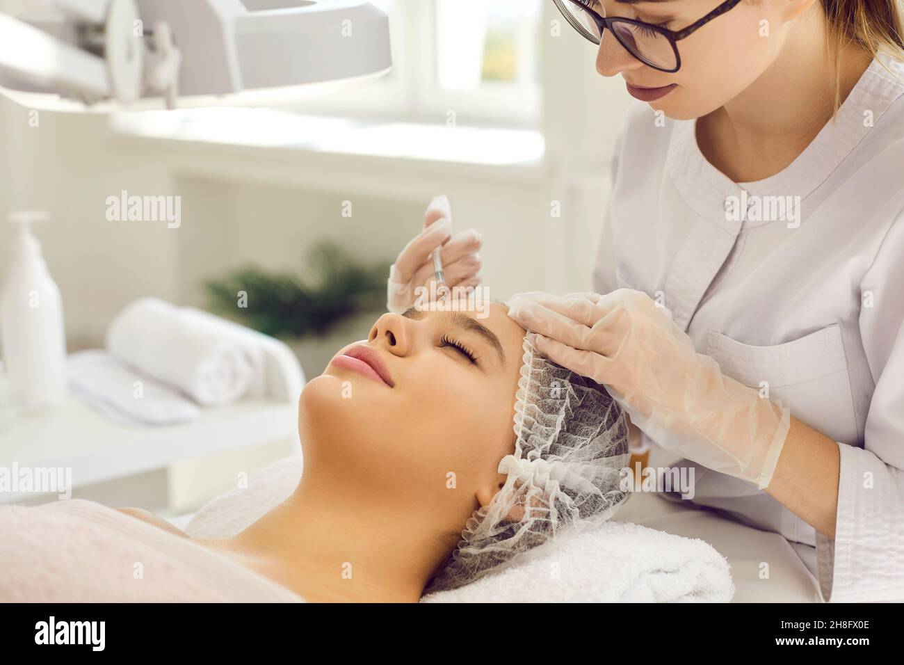Beautician make facial botox injection to client in saloon Stock Photo ...