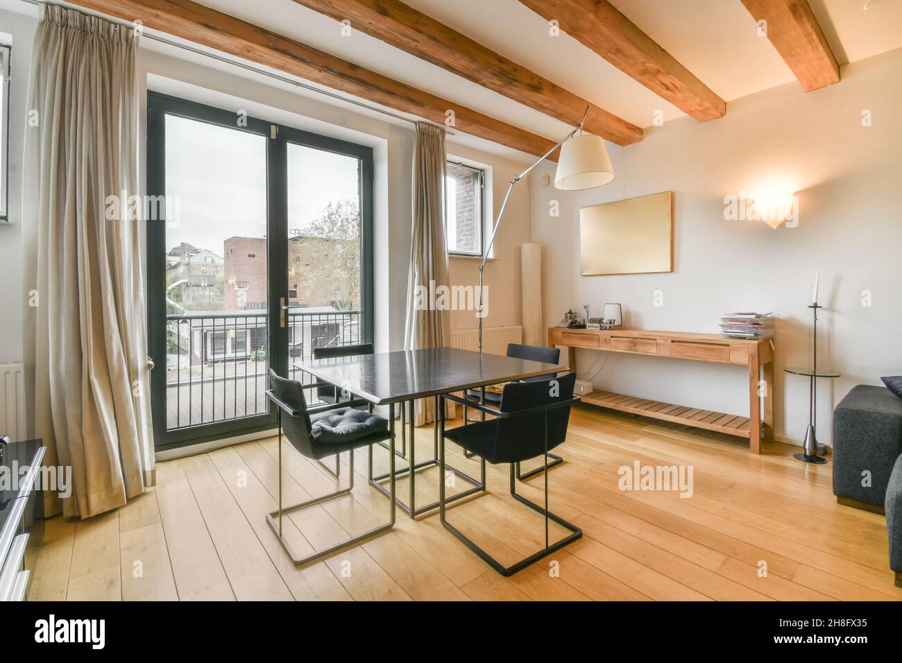 Decorative chairs and wooden table in dining room Stock Photo - Alamy