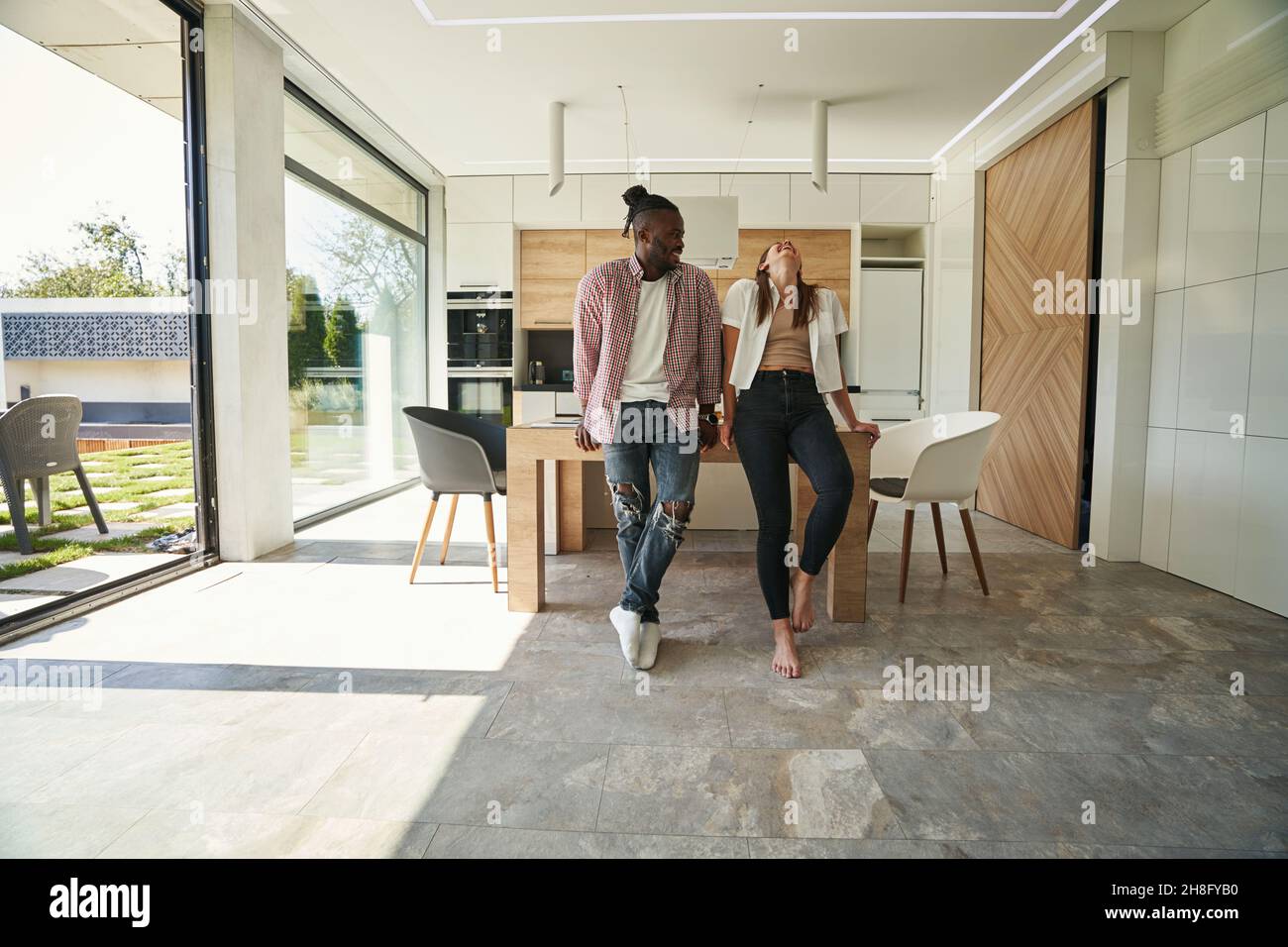 Standing beside table hi-res stock photography and images - Alamy