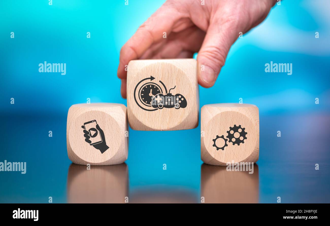 Wooden blocks with symbol of video game addiction concept on blue ...