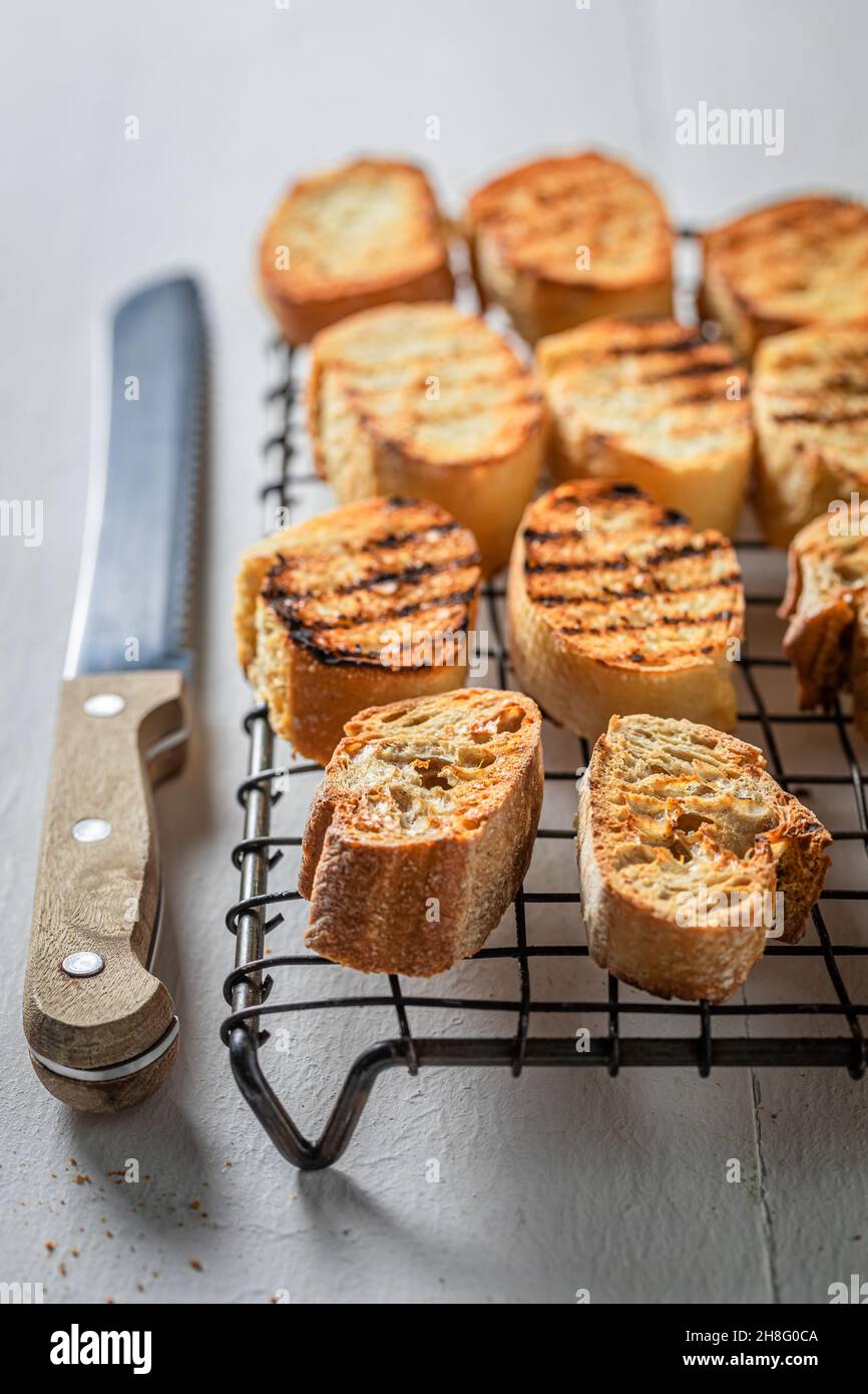 Toasted wholegrain bread roasted on the grill grate. Golden toast on ...
