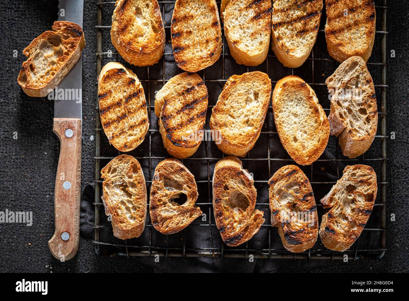 Homemade nad fresh toasted wholegrain bread roasted on the grill grate ...