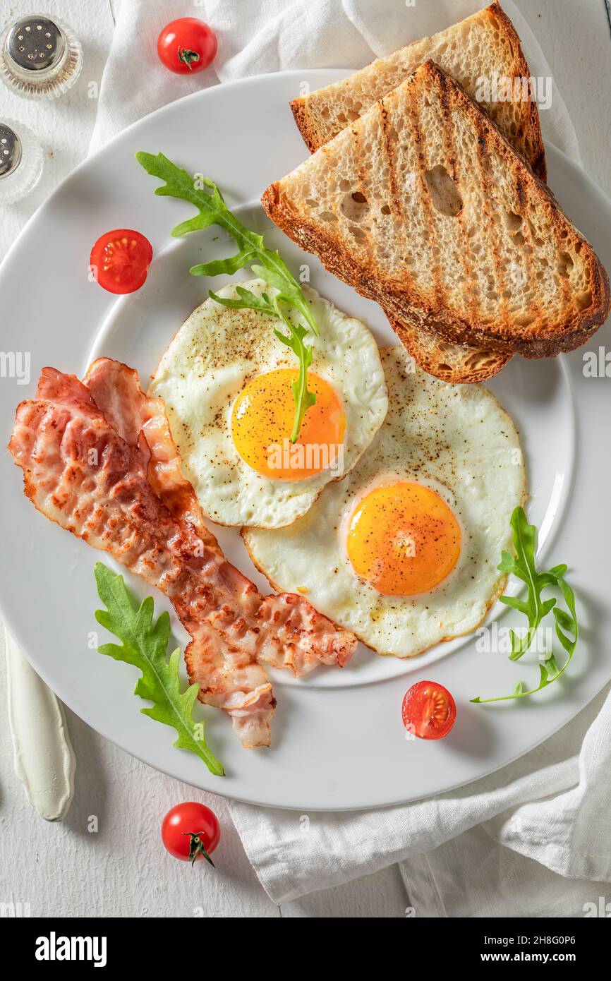 Homemade breakfast with toast, eggs and bacon. British breakfast. Toast ...