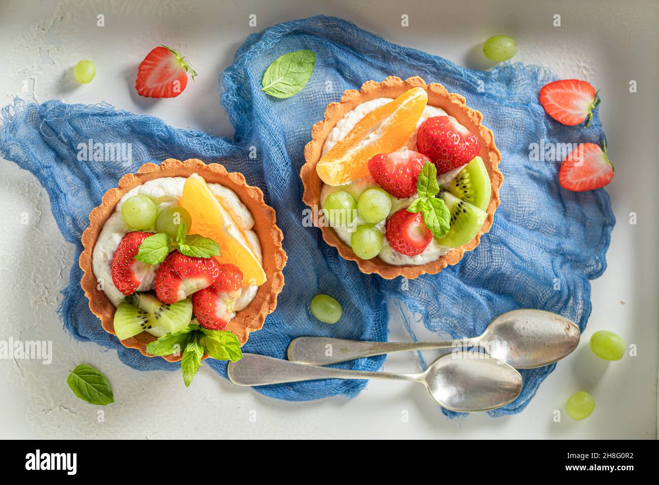 Sweet mini tart with various fruits. Simple summer dessert. Tart with ...