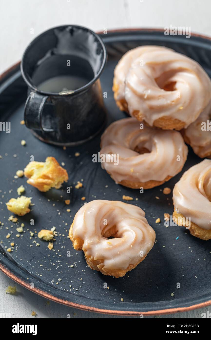 Homemade spanish donuts with white chocolate. Traditional spanish ...