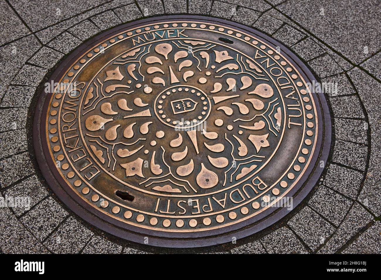 Urban manhole cover in Budapest sidewalk main street. Hungary Stock ...