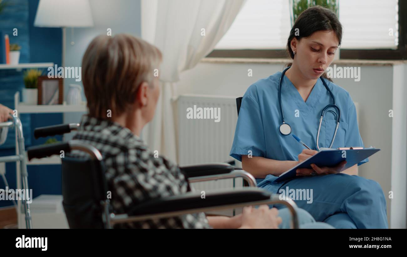 Woman nurse examining healthcare of retired patient with physical ...