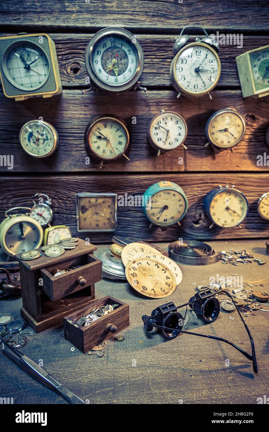 Watchmaker's workshop with repaired clocks. Ancient watchmaker's ...