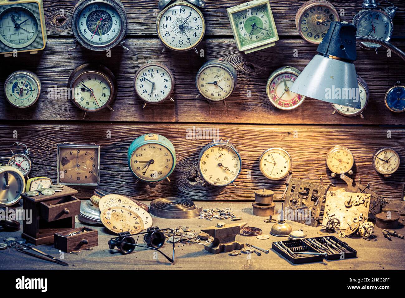 Forgotten watchmaker's workplace. Watchmaker's workplace with ruined ...