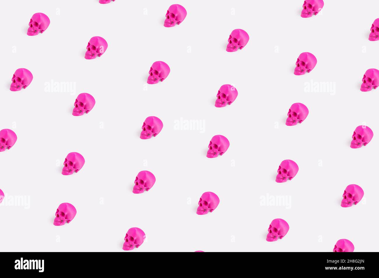 Design of Halloween pattern made of pink skulls with pattern isolated ...