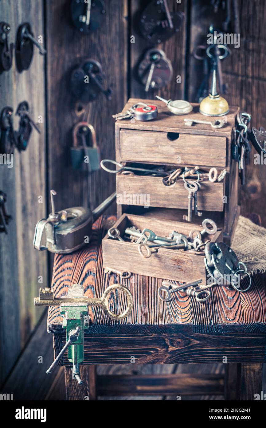 Old locksmiths workshop with tools to repair. Ancient locksmiths ...