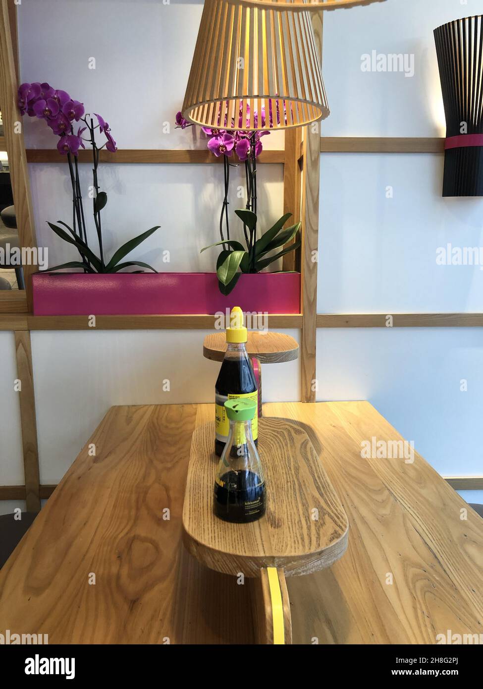 Elegant restaurant interior with condiments at the wooden dining table ...