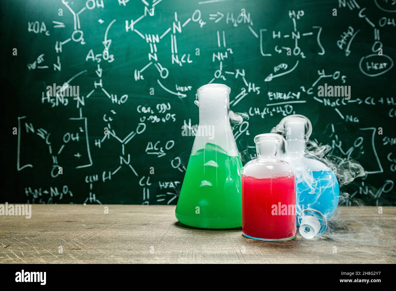 Academic chemistry class with beakers and books. Practical chemistry ...