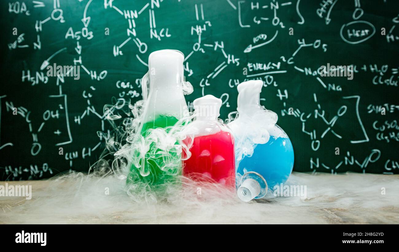 University laboratory with books, beakers and periodic table. Practical ...