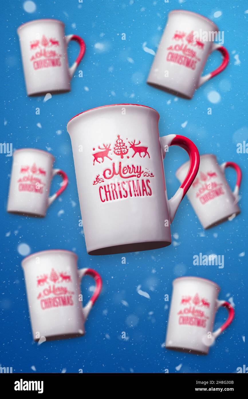 Merry Christmas mugs with blue snowy background. Christmas concept ...
