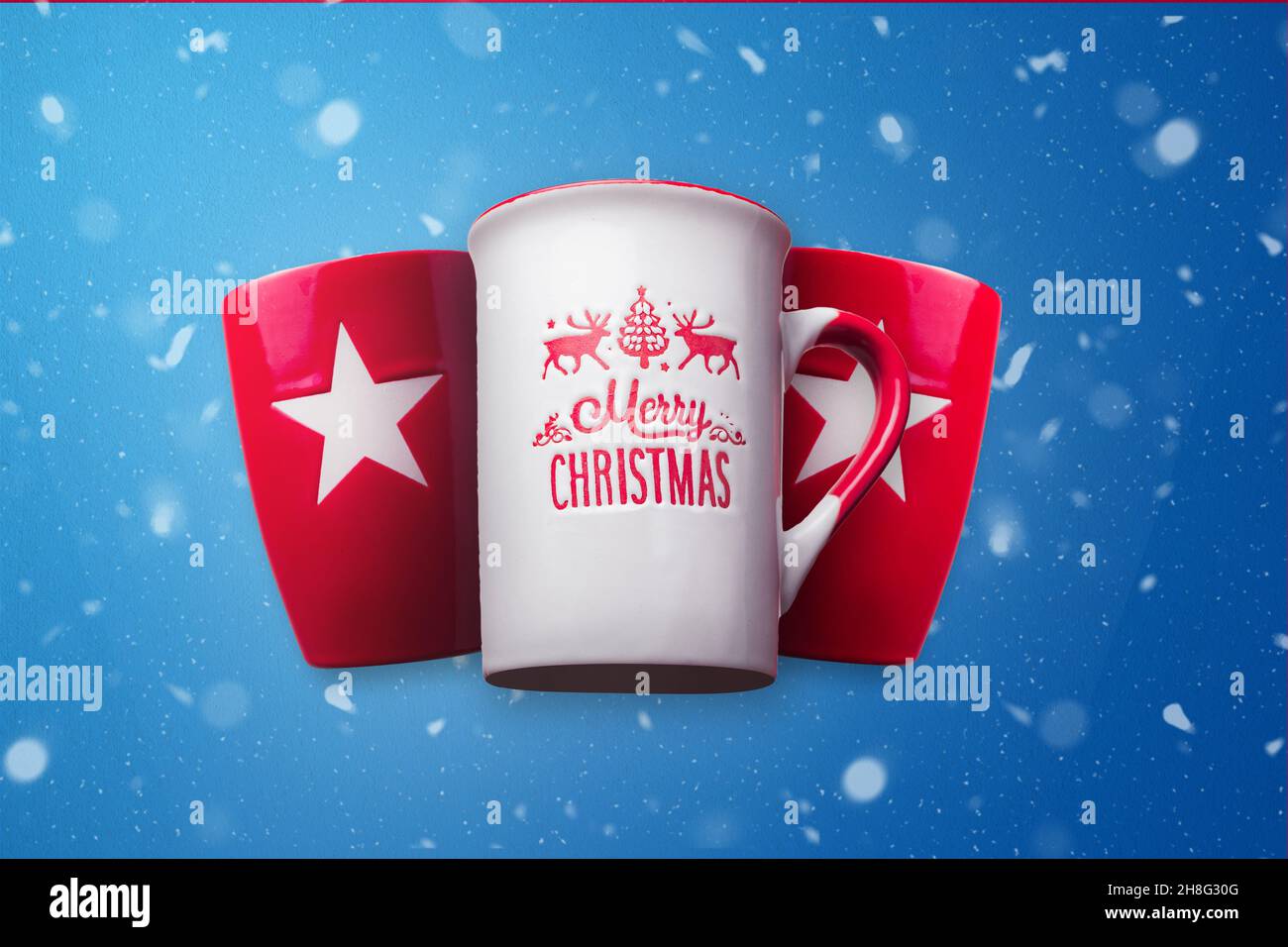 Merry Christmas mugs with blue snowy background. Christmas concept ...