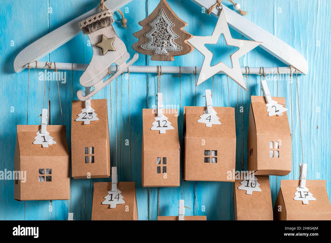 Creative Christmas Advent Calendar as cute house with number on blue ...