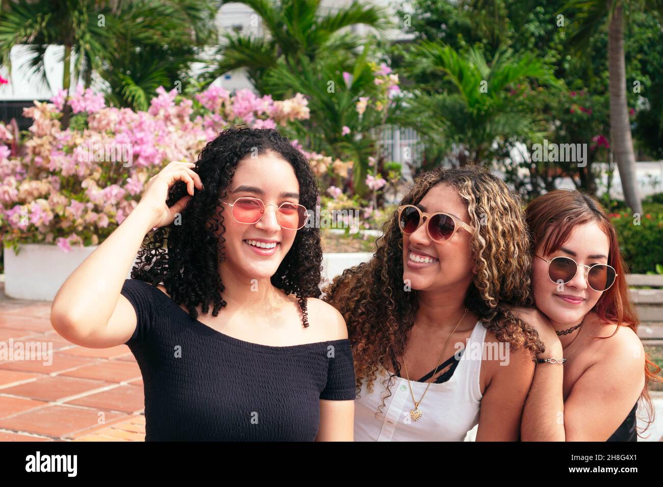 Three young friends having fun outdoors Stock Photo - Alamy