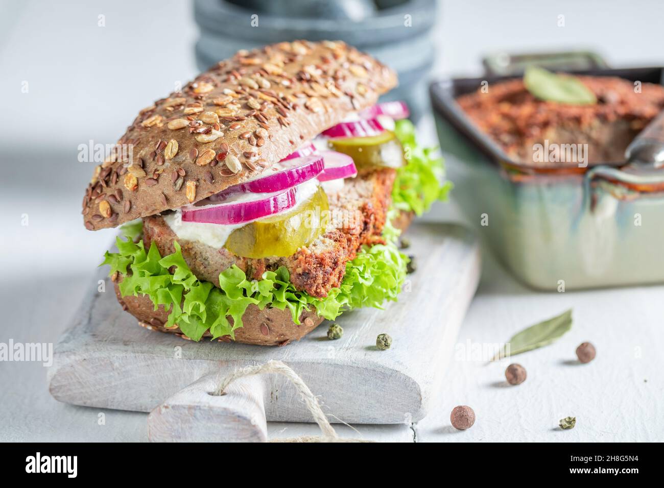 Savory pate sandwich with pickled cucumbers and lettuce as snack ...
