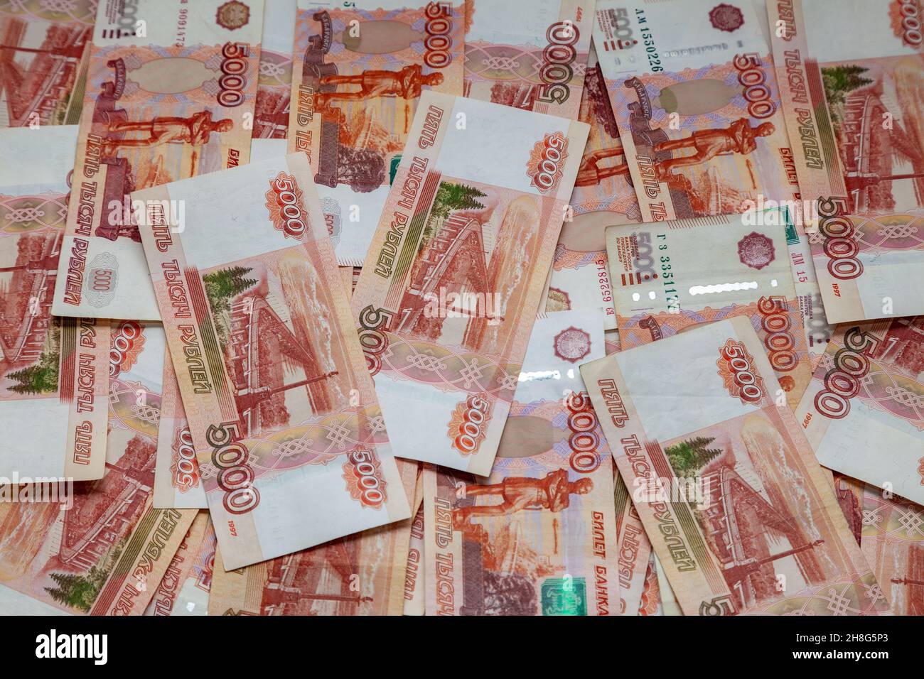 Background image - a table completely covered with five thousandth ...