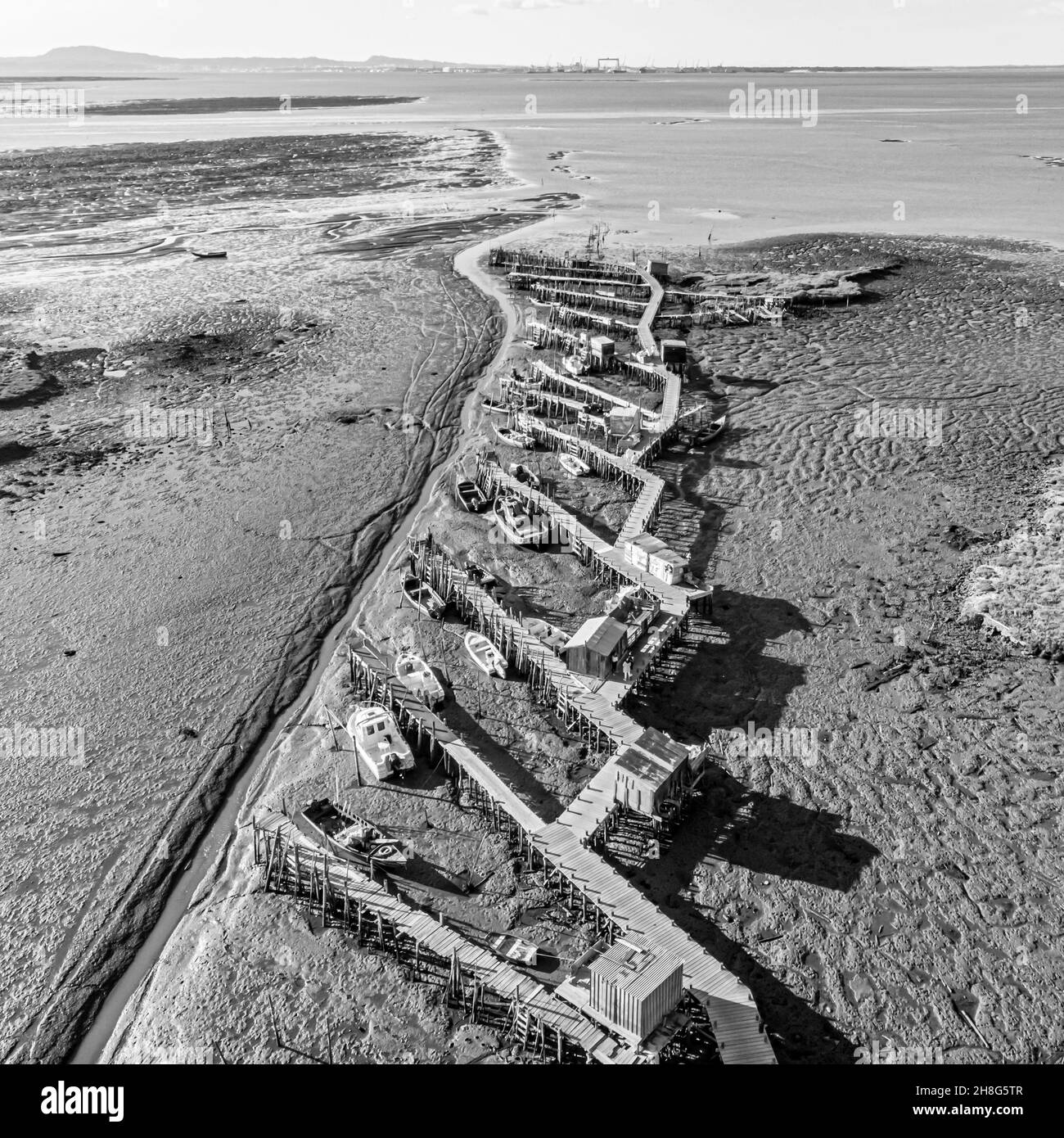Grayscale aerial view of Carrasqueira fishermen traditional port in ...