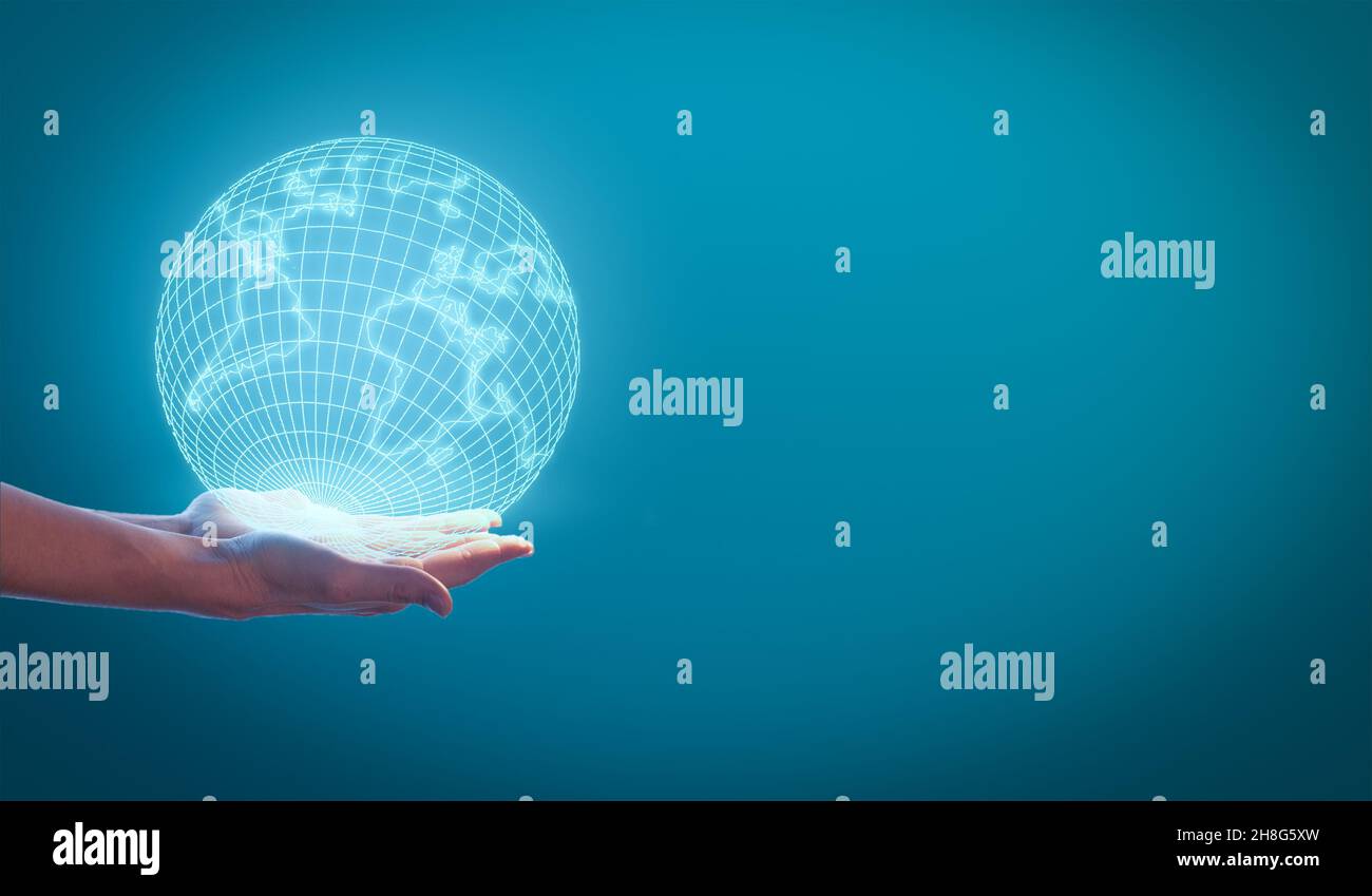 Woman's hands holding the earth globe on a blue background. Global ...