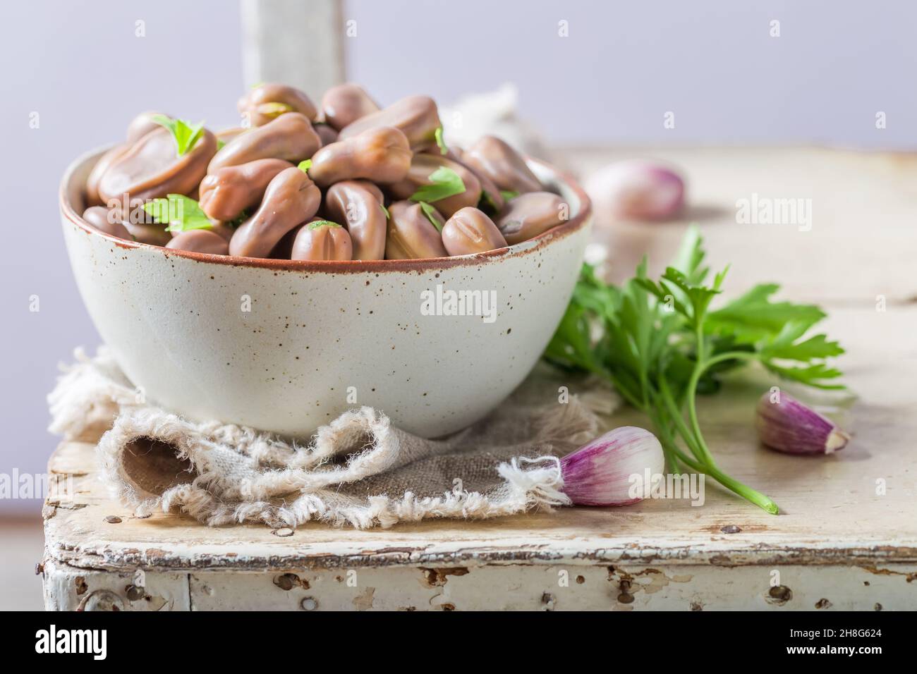 Healthy boiled broad beans as a perfect snack. Summer bowl full of ...