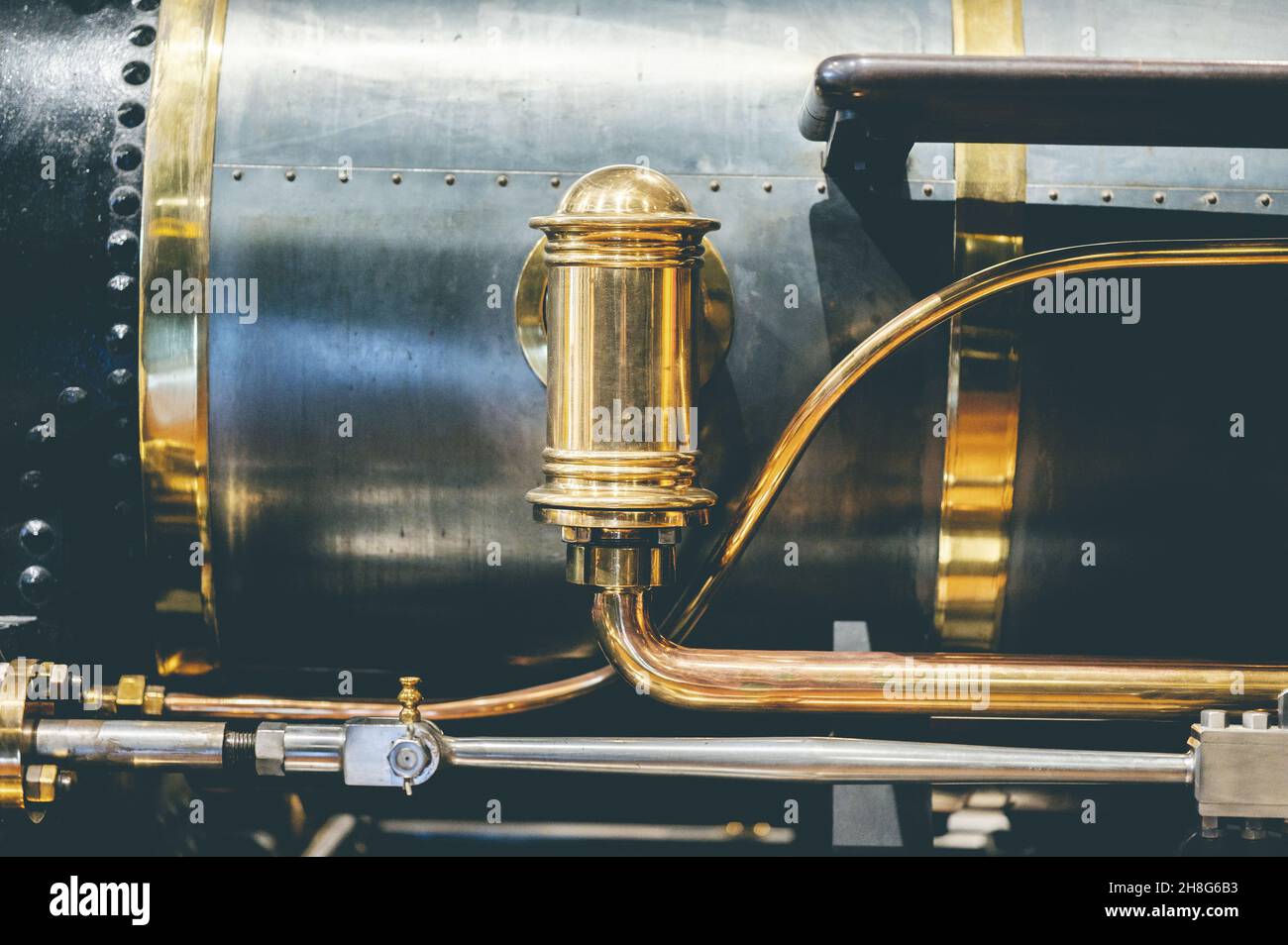 Shiny golden train whistle on a black train Stock Photo - Alamy