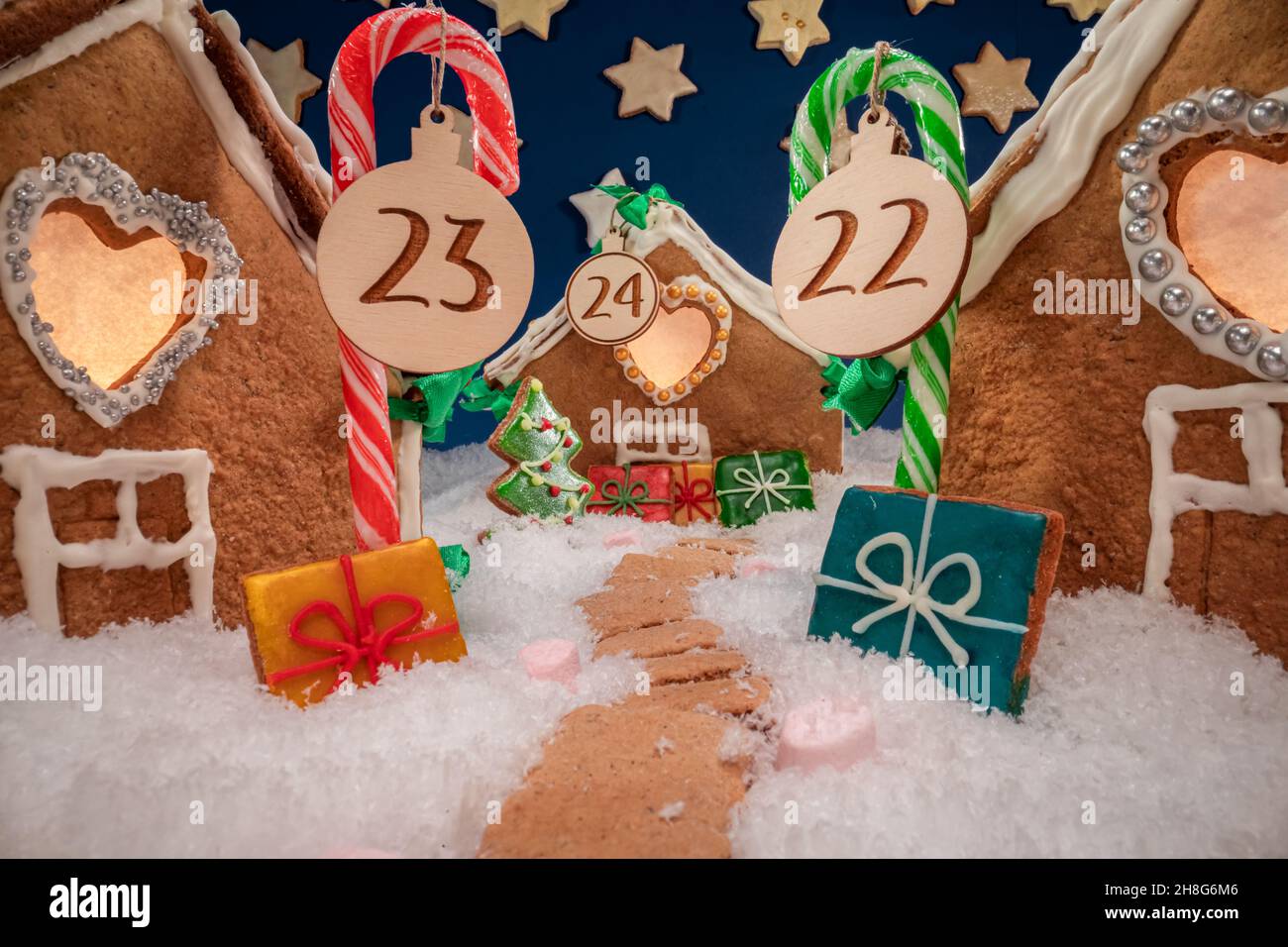 Stunning gingerbread cottages for Christmas with lights and stars ...